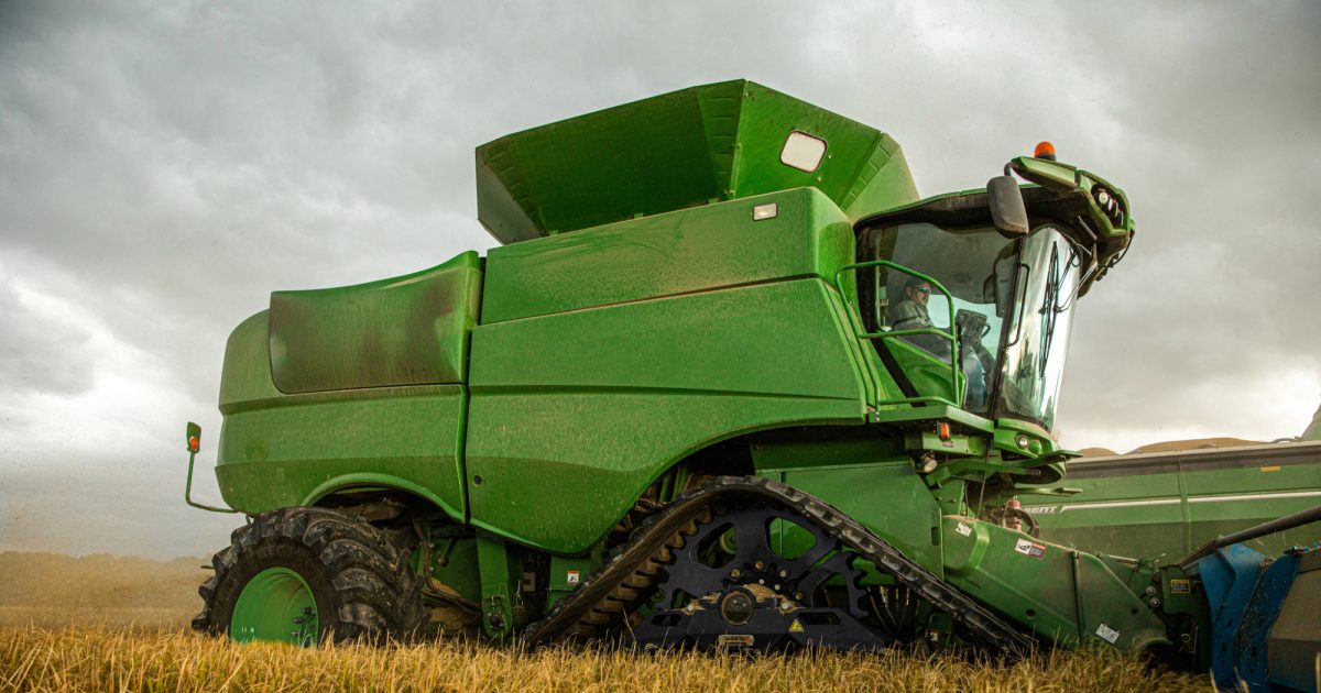 Combine harvester track system in wet conditions. | Soucy Track